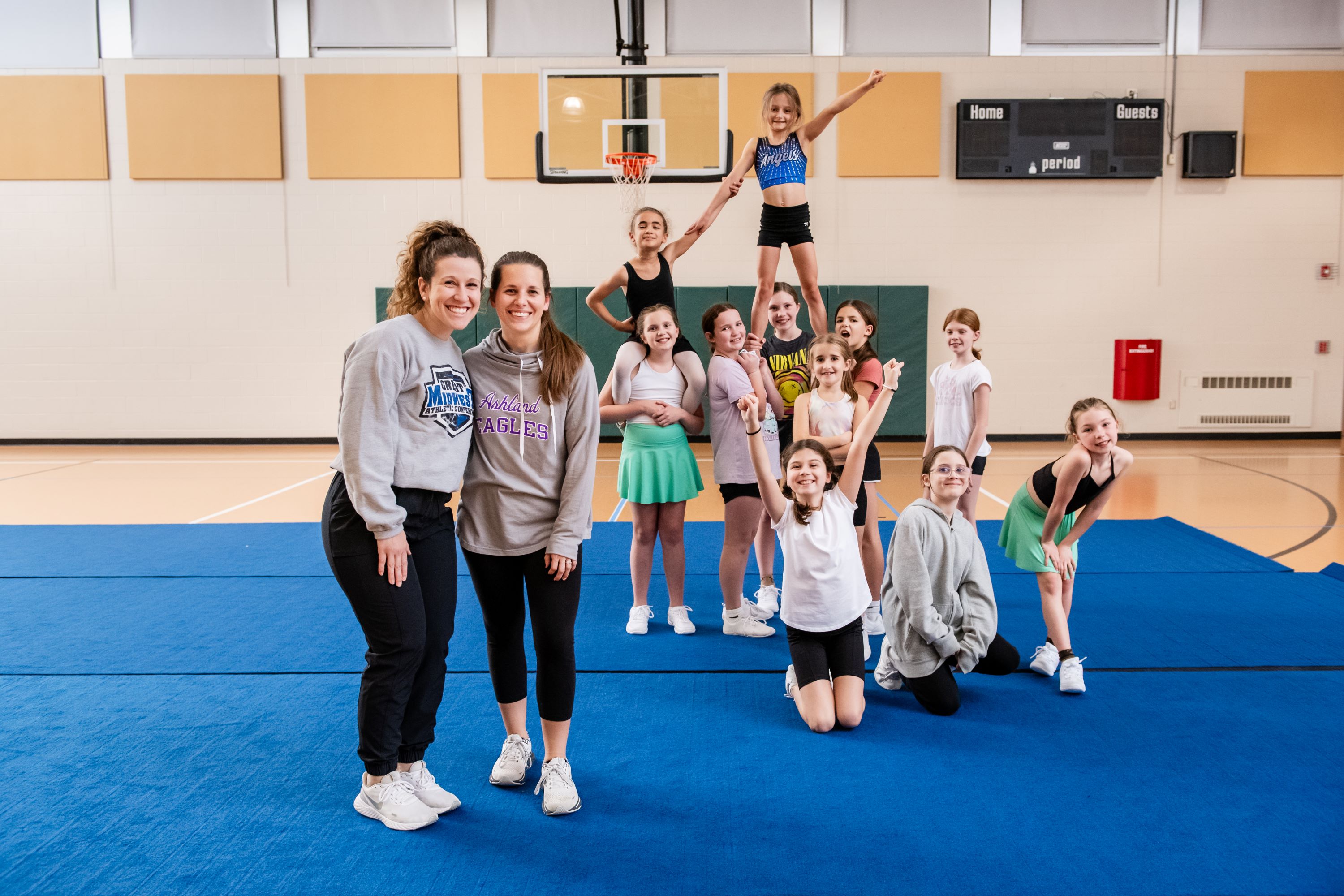 Pair of AU graduates love coaching Club STUNT together at the Kroc ...